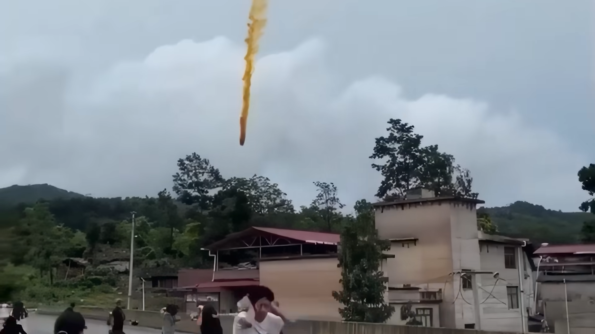 A 21 ton Chinese rocket fell near a village and left toxic orange gas ...