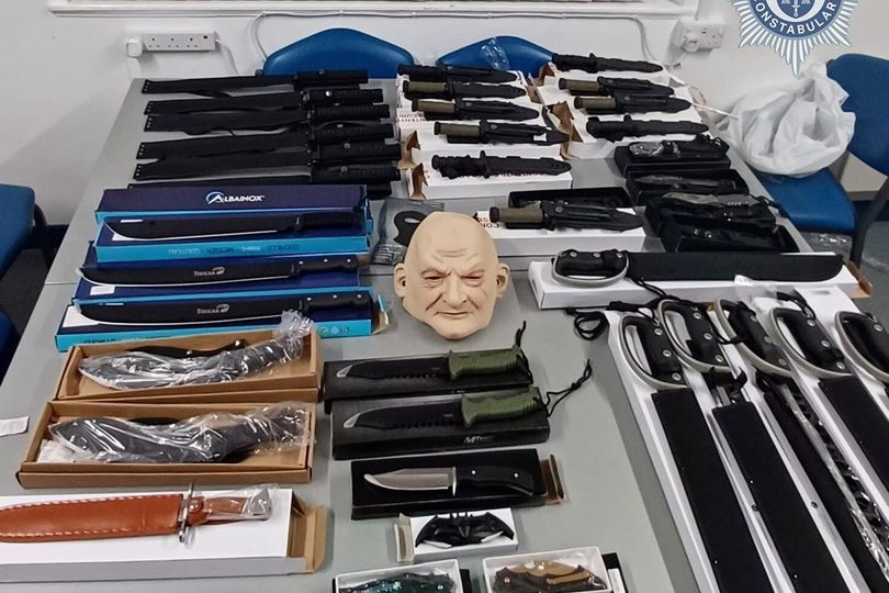 Sinister mask and 40 zombie knives seized as Birmingham pair arrested on M6