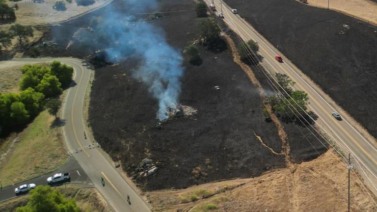Woman rescued by maintenance worker after fiery rollover Tesla crash at ...