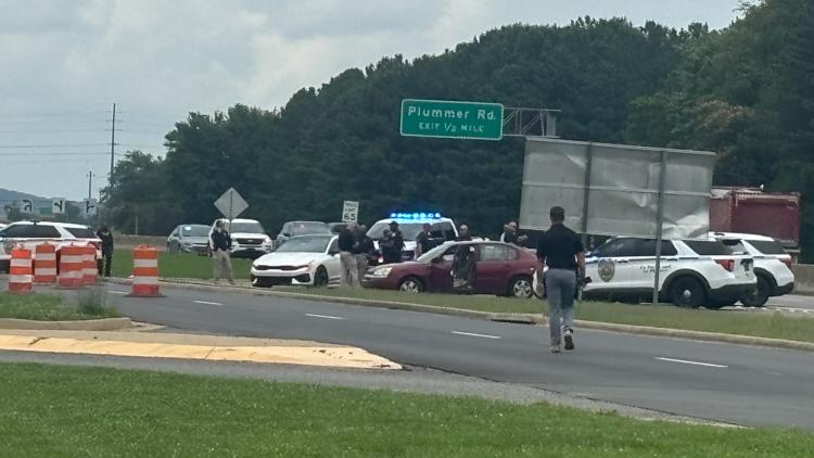 Man arrested after officer fires shot during encounter near Research Park