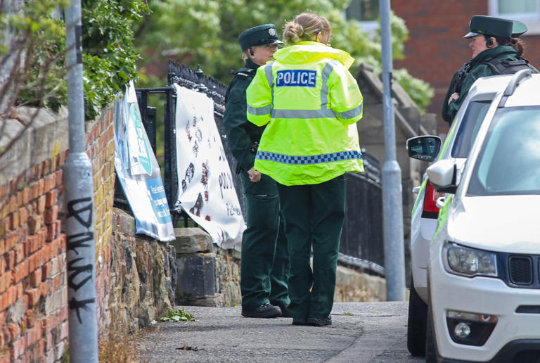 Belfast stabbing: Bus set alight as man charged with attempted murder