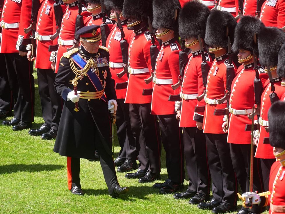 King Charles and Queen Camilla present new colours at Buckingham Palace