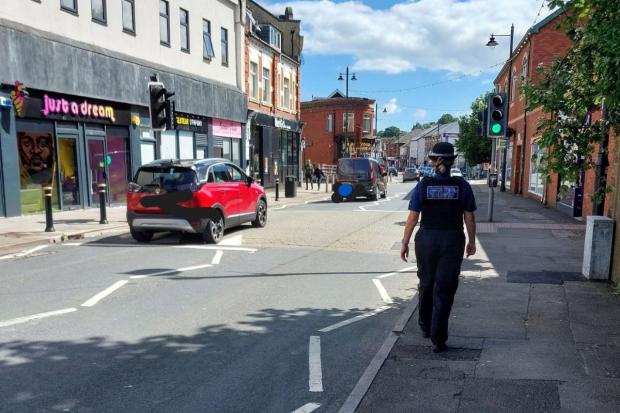 Police officers patrol town's high street targeting urgent illegal ...