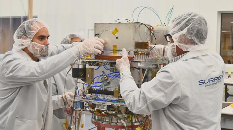 Why does NASA need to use atomic clocks in space?