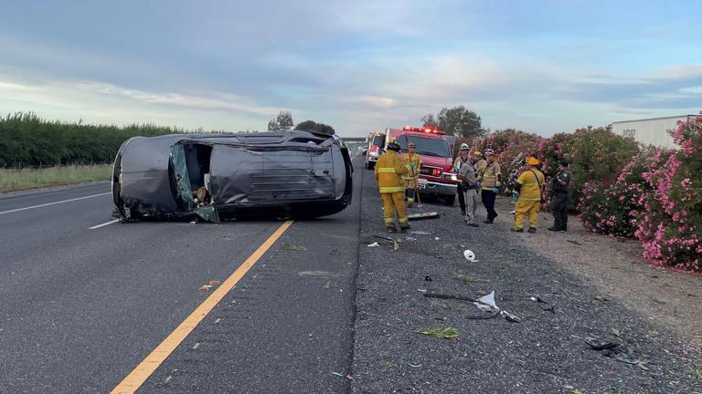 Driver checking on child loses control, overturns vehicle on I-5