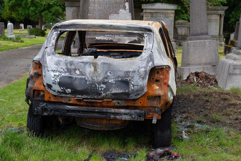 Car driven into gravestone and torched at Glasgow cemetery