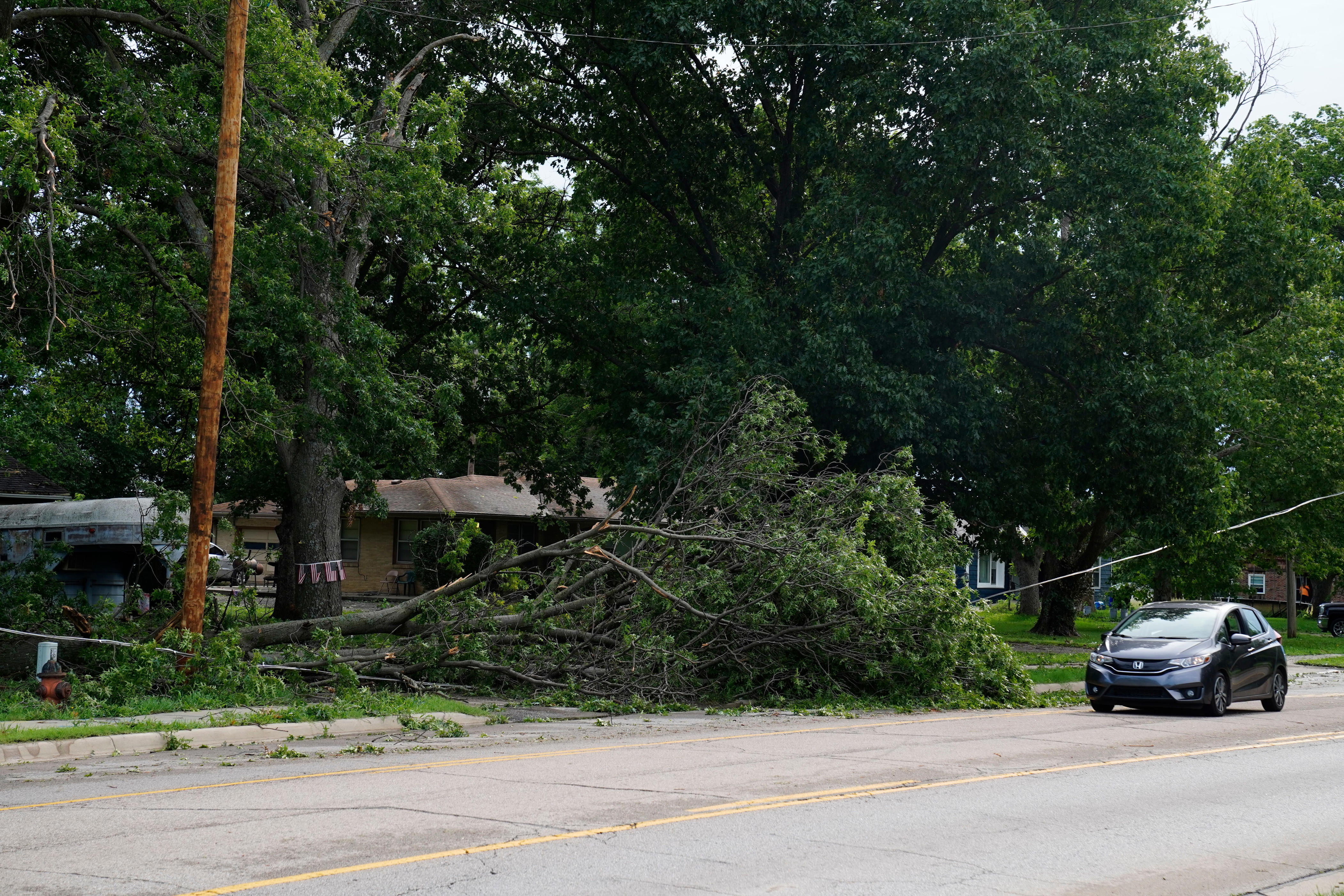 Kansas storms bring flooding, power outages and 113-mph winds