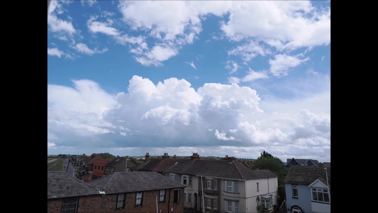 Storm clouds develop over Thames Estuary as weather warms up in Kent, UK