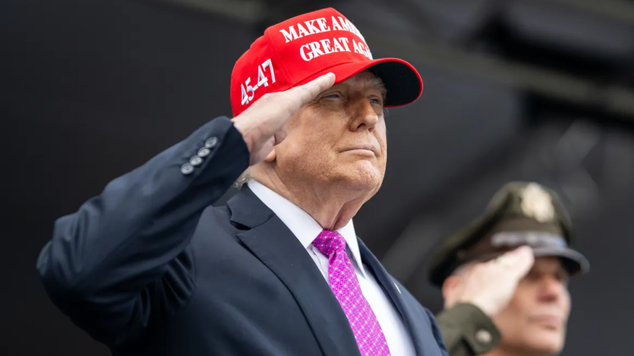 Trump’s national anthem salute sparks questions from observers