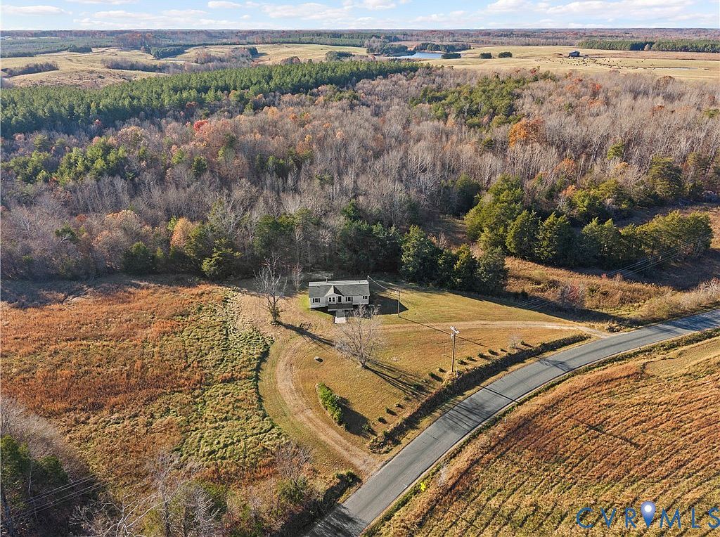 Embrace this 1988 home in Meherrin, Virginia, set on 6 wooded acres ...