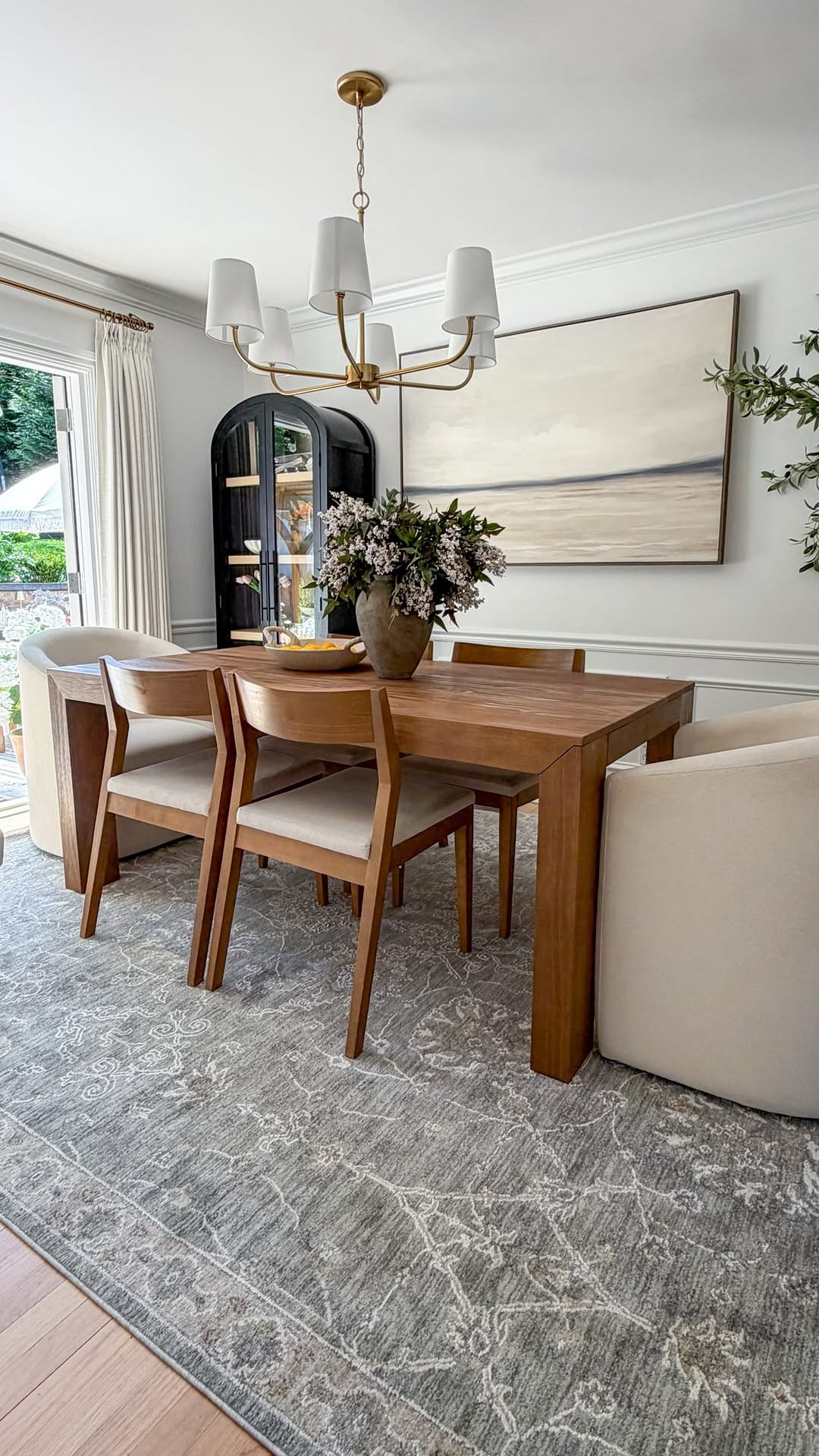 Neutral rug adds warmth and texture to dining room