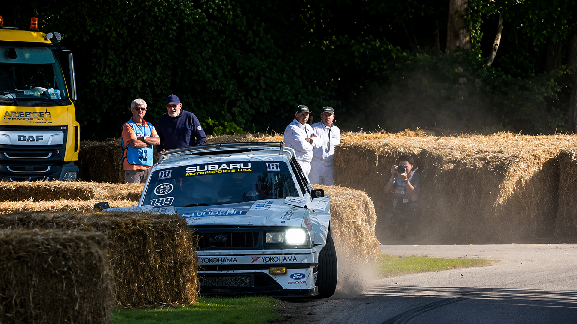 Subaru rally car crashes hard at Goodwood corner