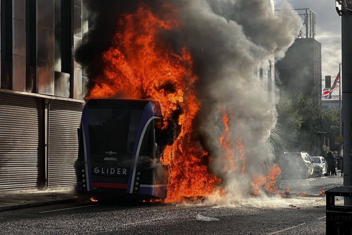 Bus set alight by masked protesters as police dealing with ‘pockets of ...