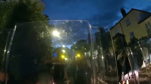 Man seen throwing chairs at police during Henry Nowak protest charged