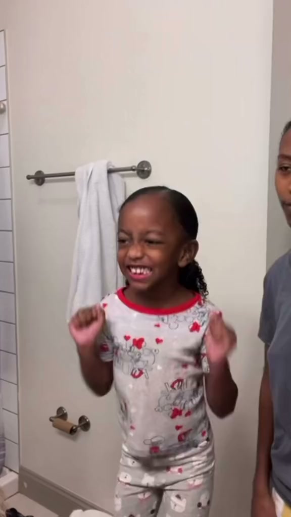 Getting my daughters curls ready with our go to slick ponytail