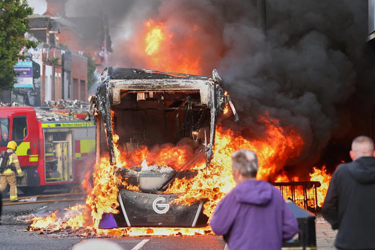 Belfast erupts after police charge man over 'brutal attempted beheading'