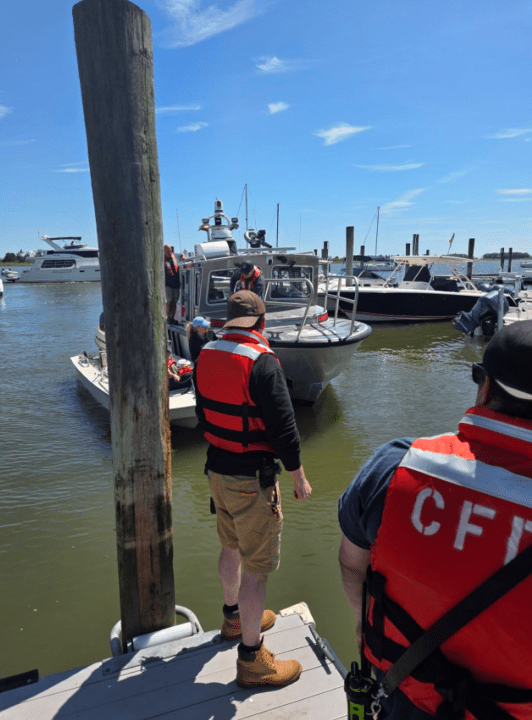 Photos: Children, adults rescued after boat engine trouble in Clinton