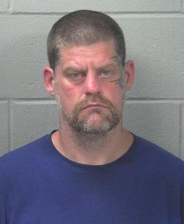 Man arrested for trying to light car on fire with dog inside