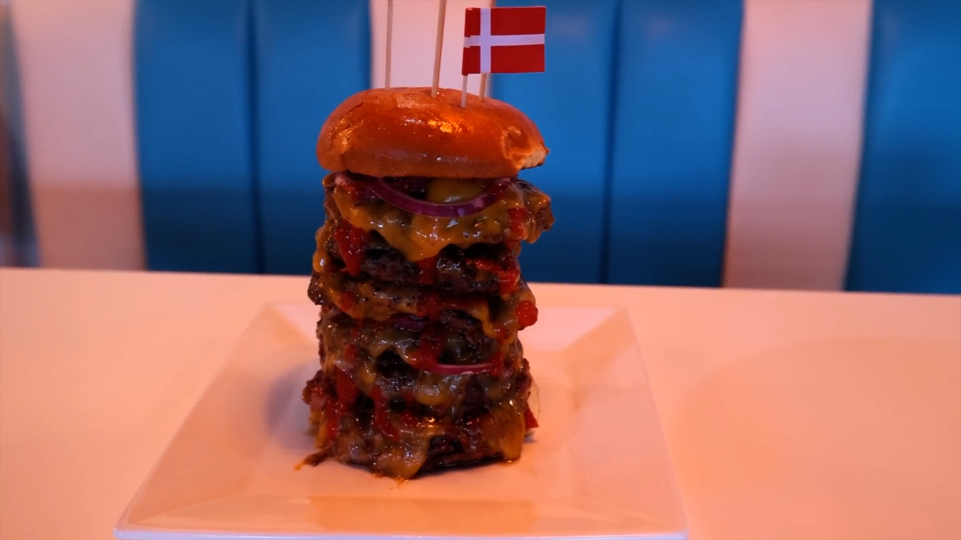 She destroys giant 6-patty burger speed challenge for a mystery prize
