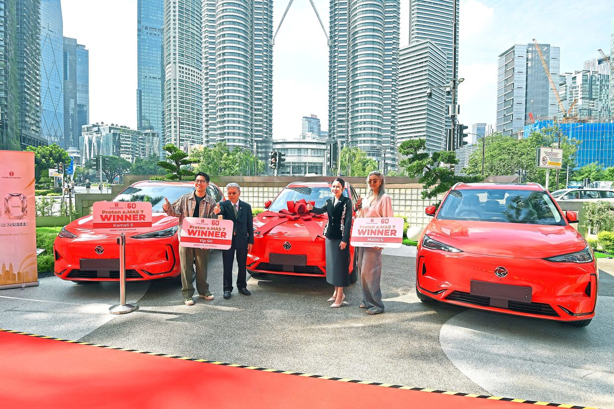 Bank surprises customers with EV lucky draw prize
