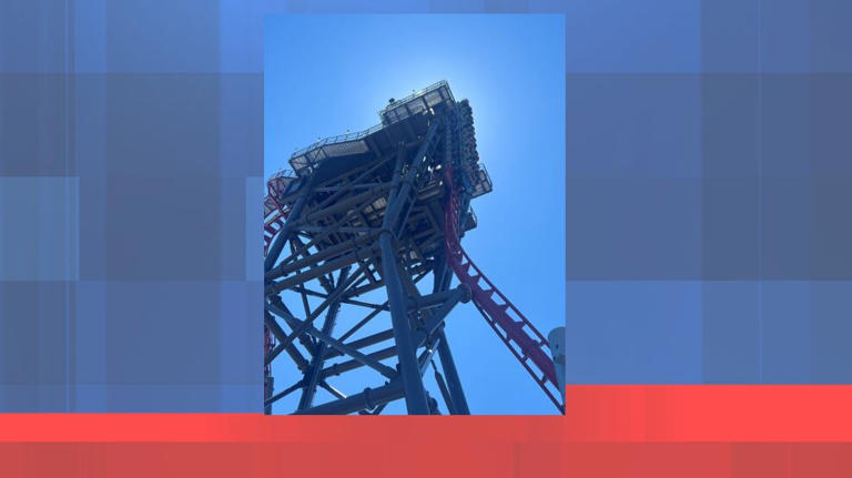Roller coaster riders stuck high in the air at Cedar Point