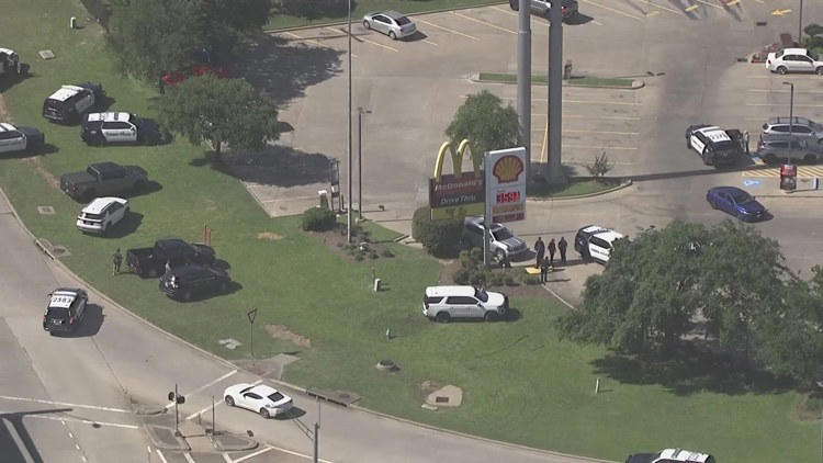 Heavy law enforcement presence at gas station along North Freeway at ...