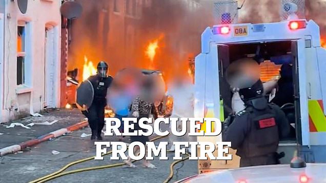Family pulled from house in Belfast as fire takes hold next door