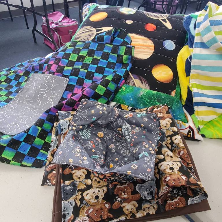 Master quilters and 4-H members sew together during 4-H sewing series
