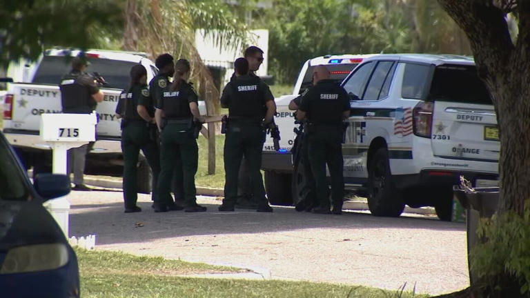 Bus stop shooting suspect remains at large, woman’s condition improving