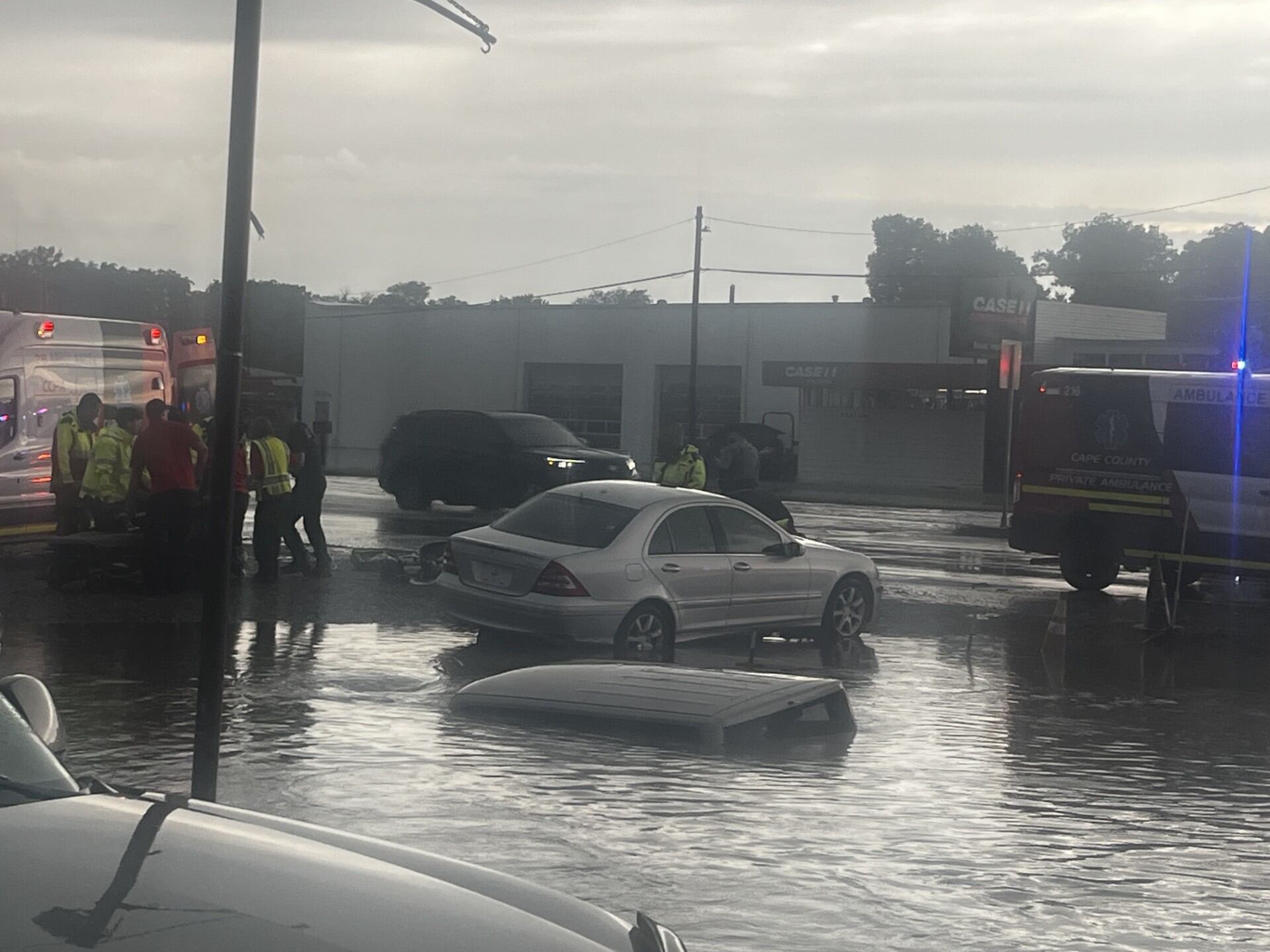 Man rescues driver from submerged vehicle during flash flooding