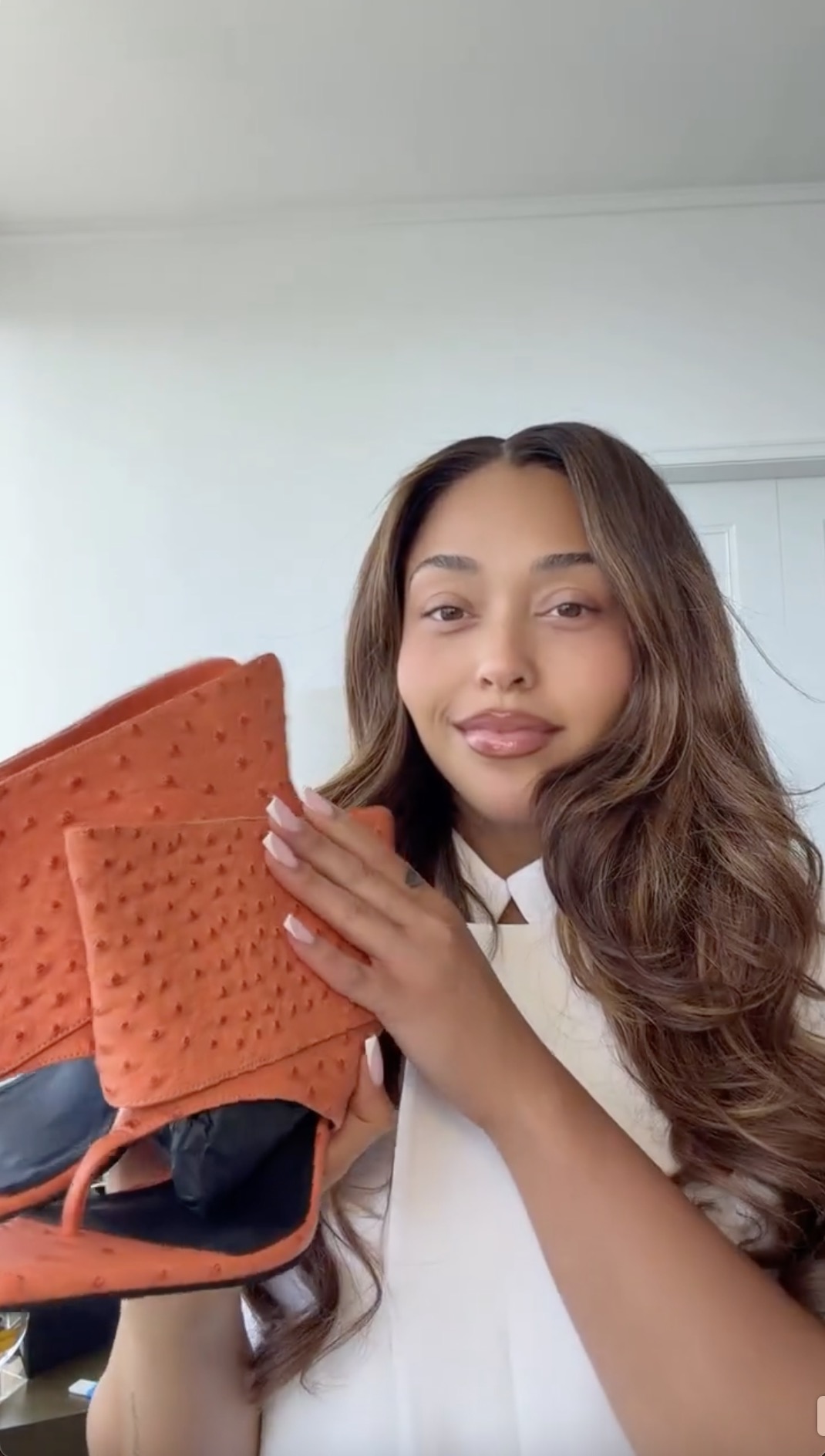 How Jordyn Woods brought her good-luck purse to Knicks Game 3 despite ...