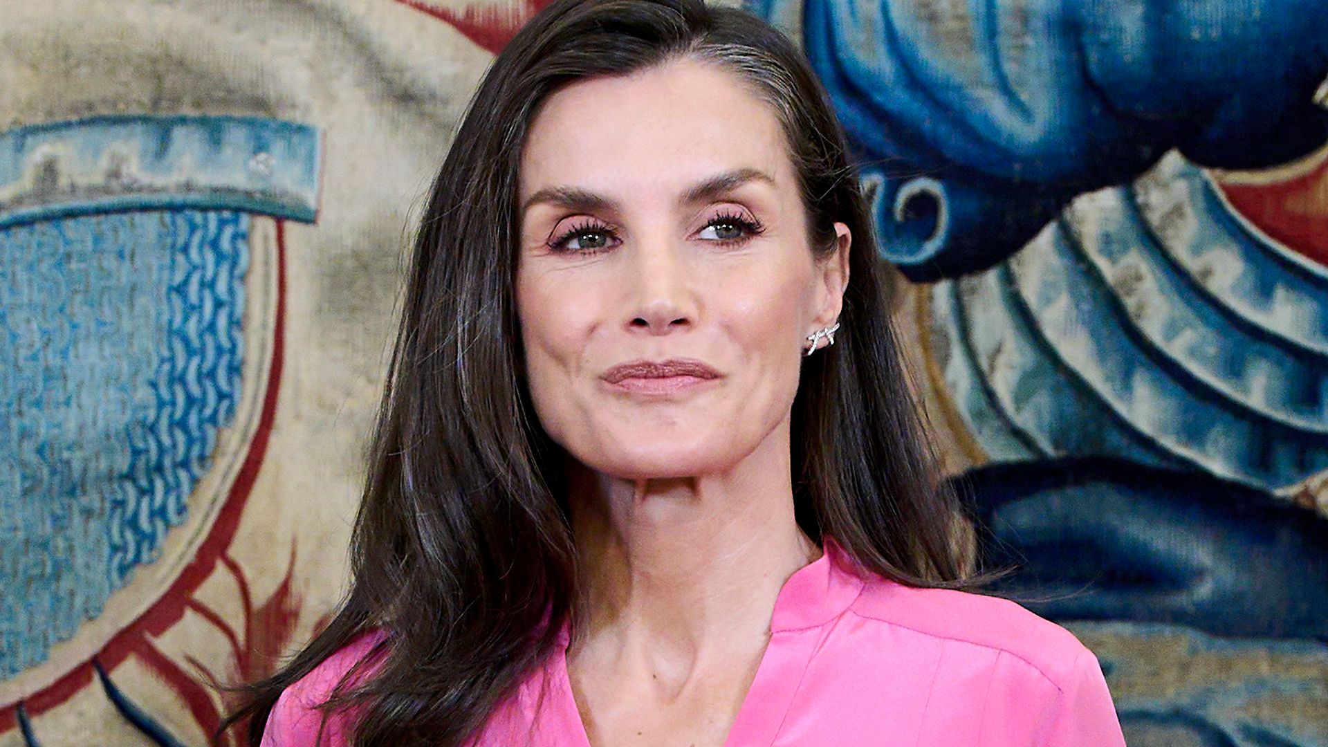 Queen Letizia swaps her papal white looks for a striking oversized pink ...