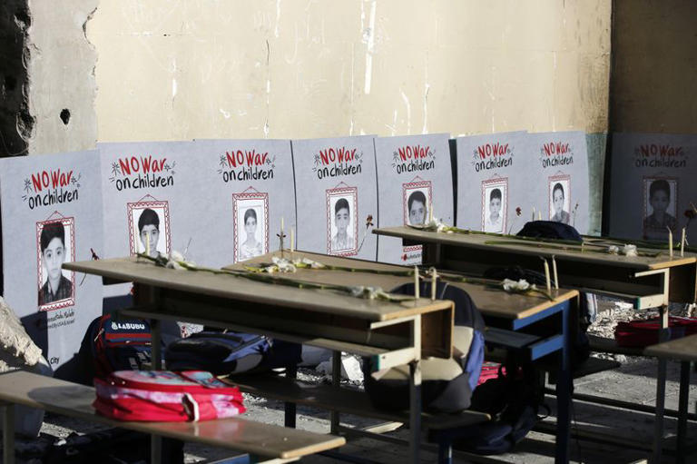 Iranian national team honors school bombing victims upon arrival in ...