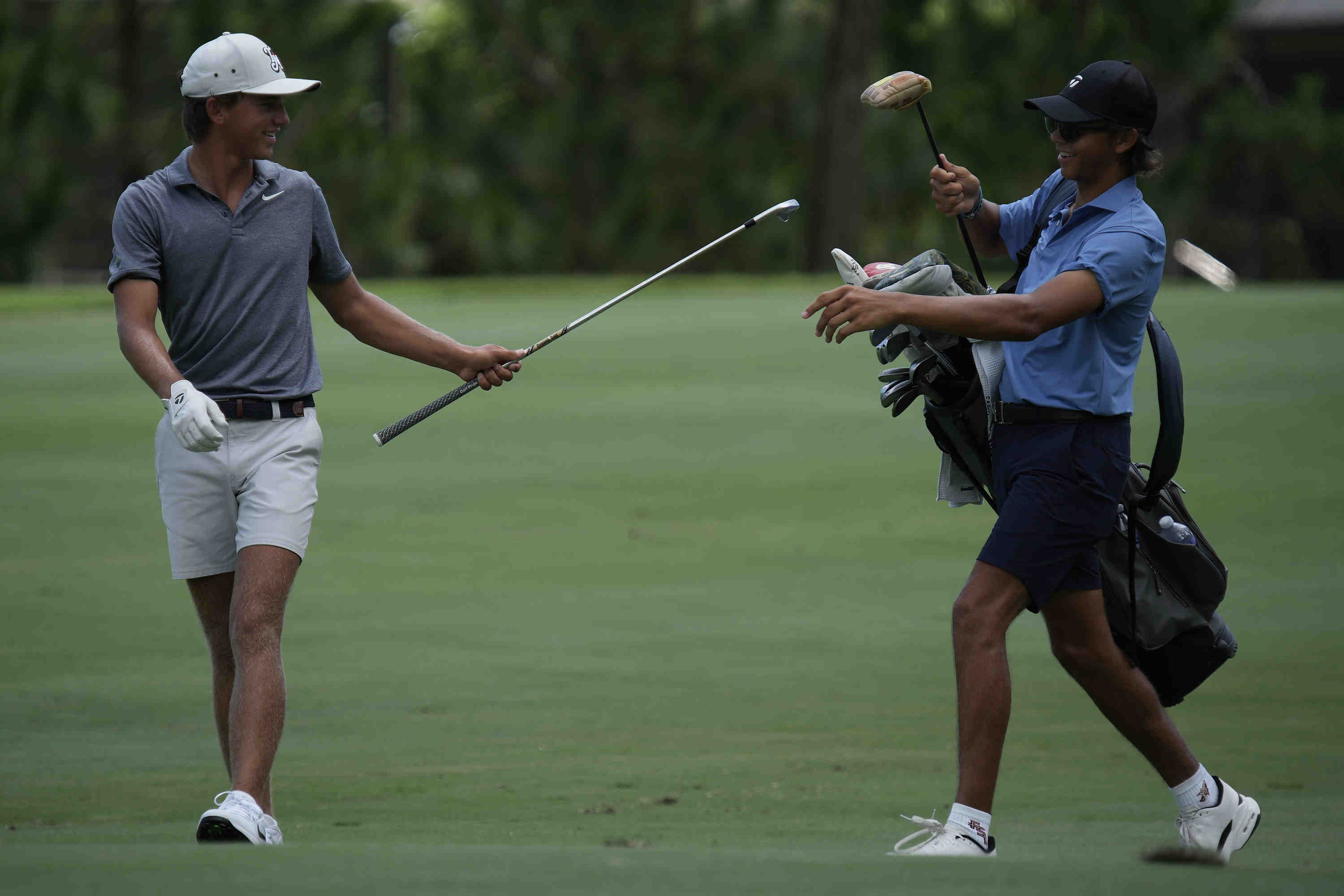 Photos: Charlie Woods caddies for Miles Russell at US Open qualifier