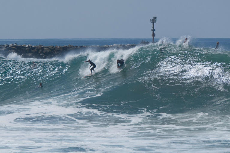 Monster waves wallop SoCal as 15-foot surf sparks beach warnings