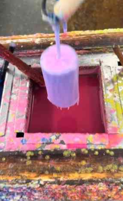 Dropping melted wax into the mixture