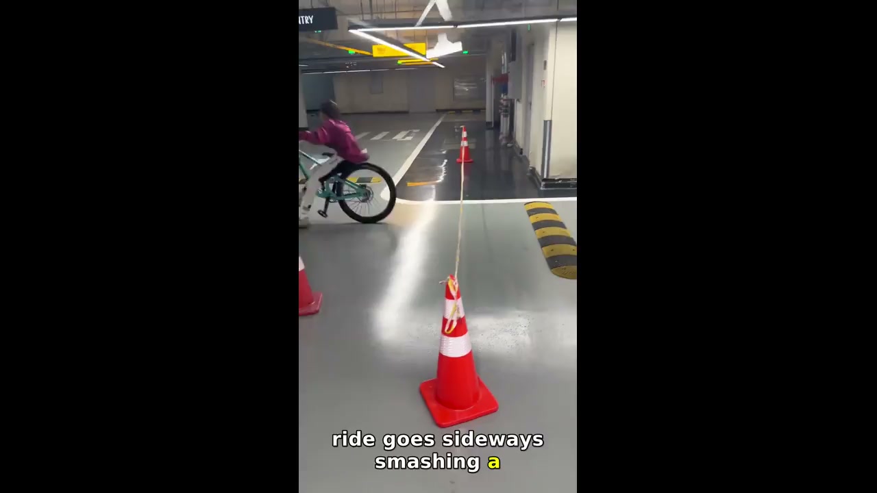 Teen crashes bike into ceiling light in Beijing parking garage