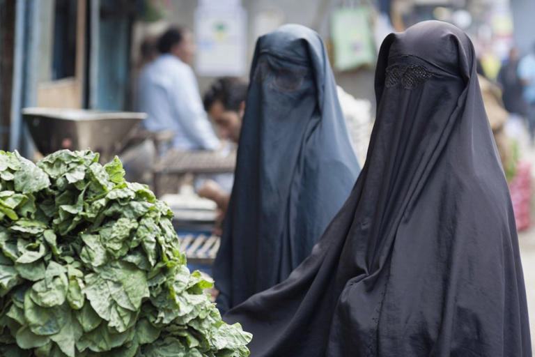 Spanish tourist hotspots consider burka ban and £25,000 fines in ...