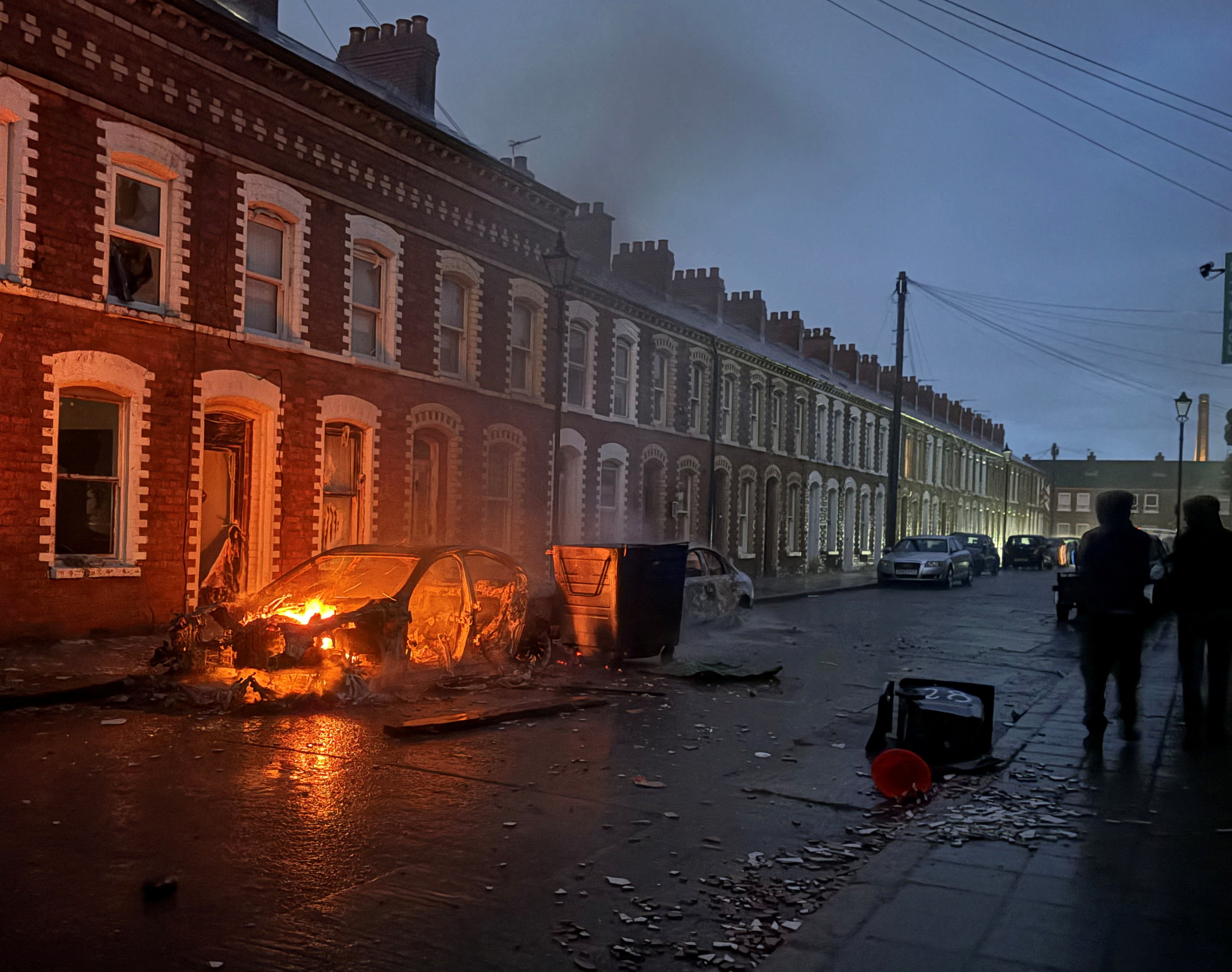 Protesters torch cars, buildings in Belfast after knife attack