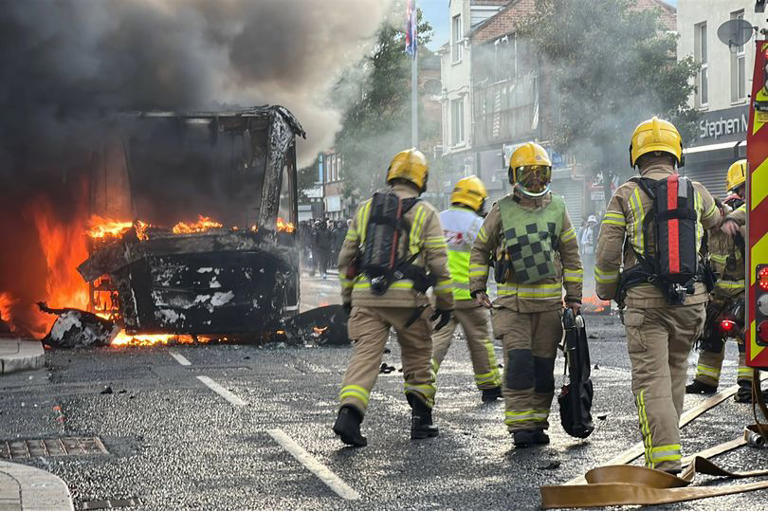 Bus set on fire as Belfast anti-immigration protest erupts after stabbing