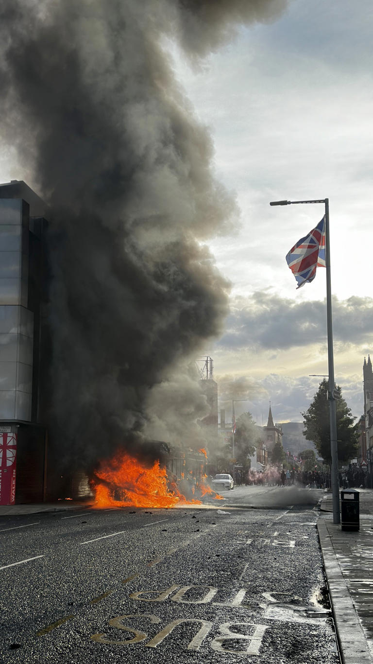 Violence condemned after Tommy Robinson stokes up disorder in Belfast