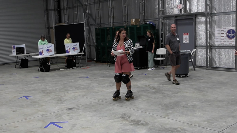 Video: Precinct clerk skates through primary voting