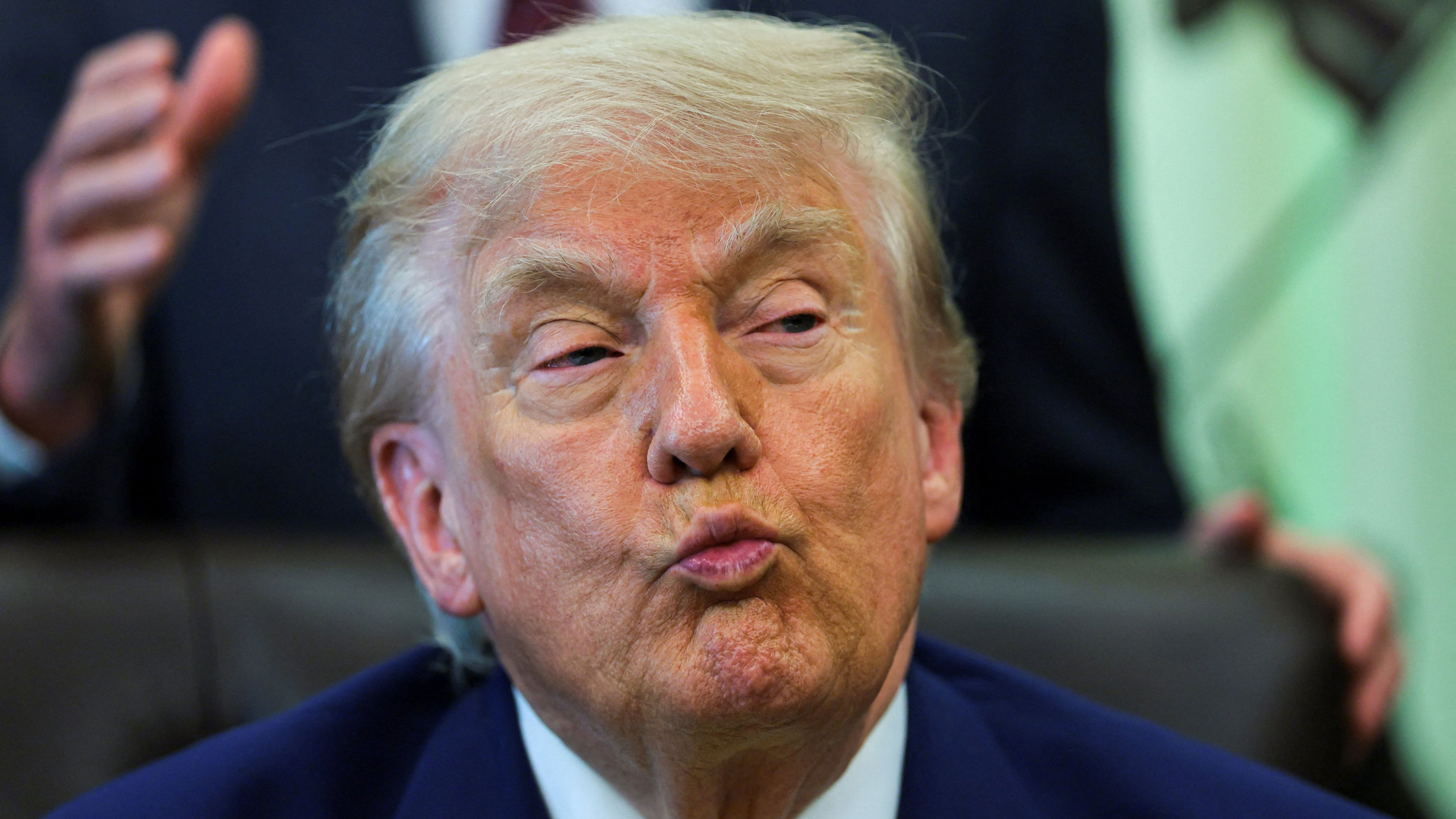 Donald Trump asks his supporters to sign his birthday card