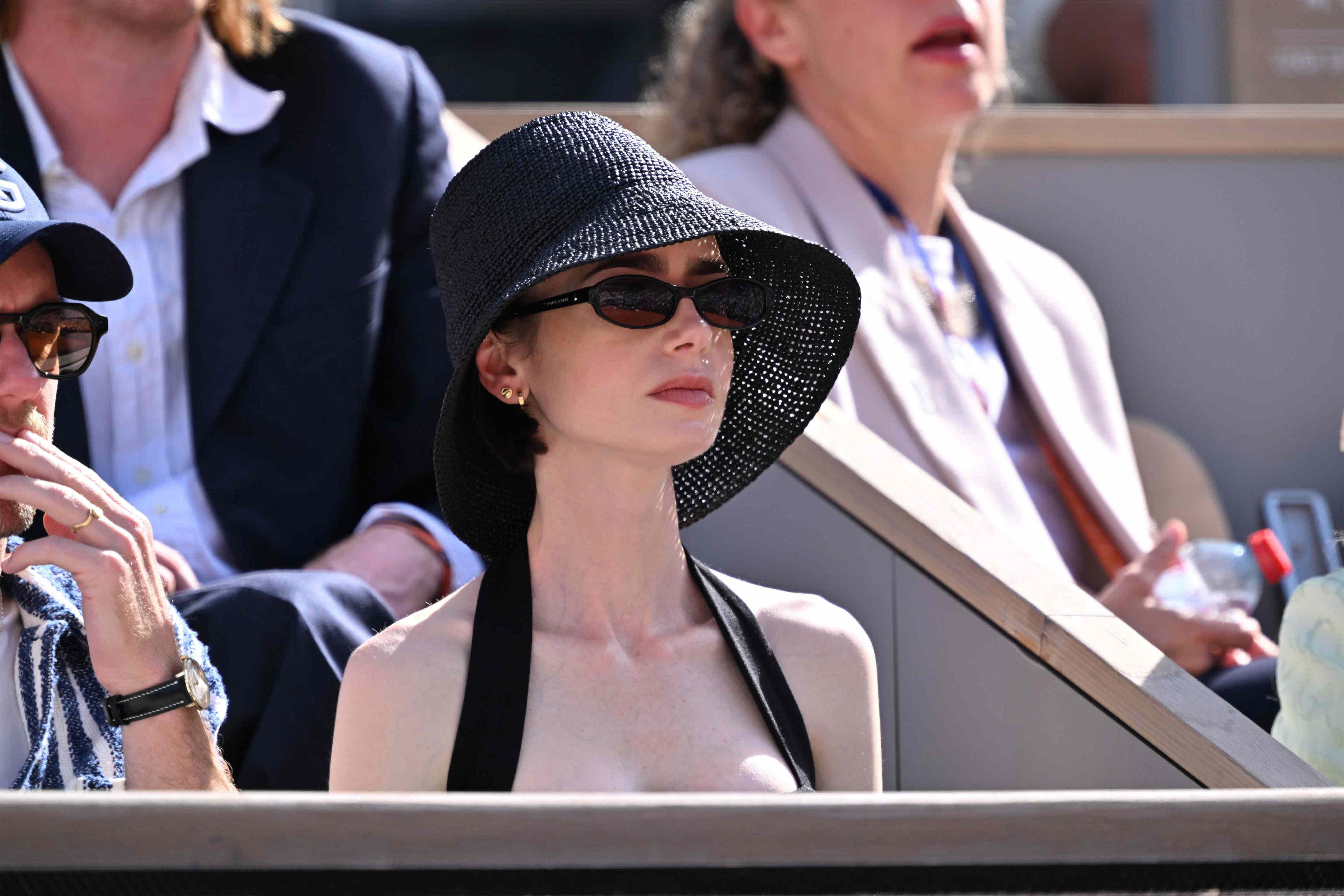 Lily Collins, 37, covered up beneath the Paris sun in the packable ...