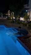 Man enters swimming pool and slips on steps