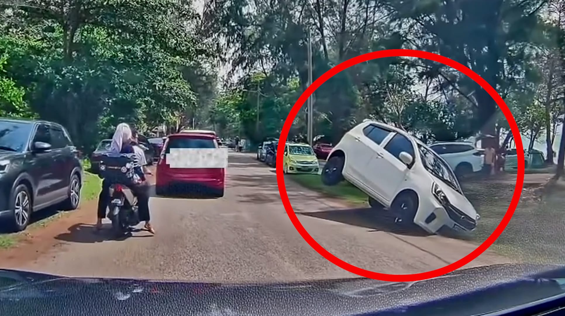 Car tips forward when driver accidentally veers onto roadside slope