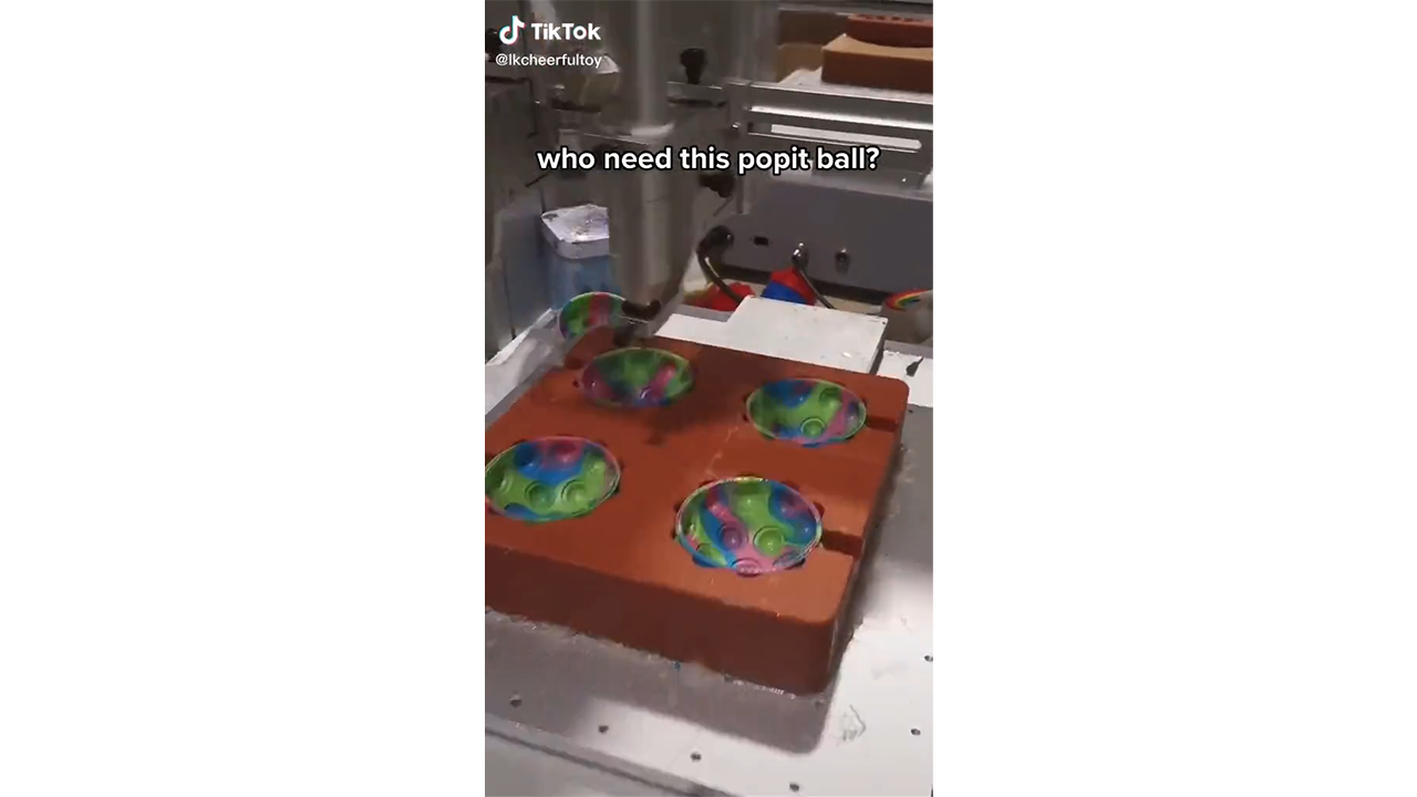 Making rainbow pop it balls with a precision molding machine