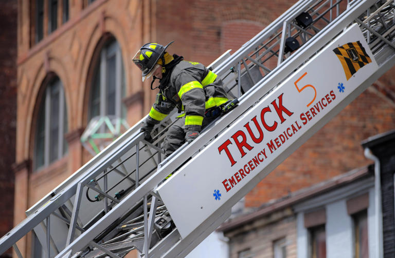 Firefighters find body outside burning South Baltimore apartment