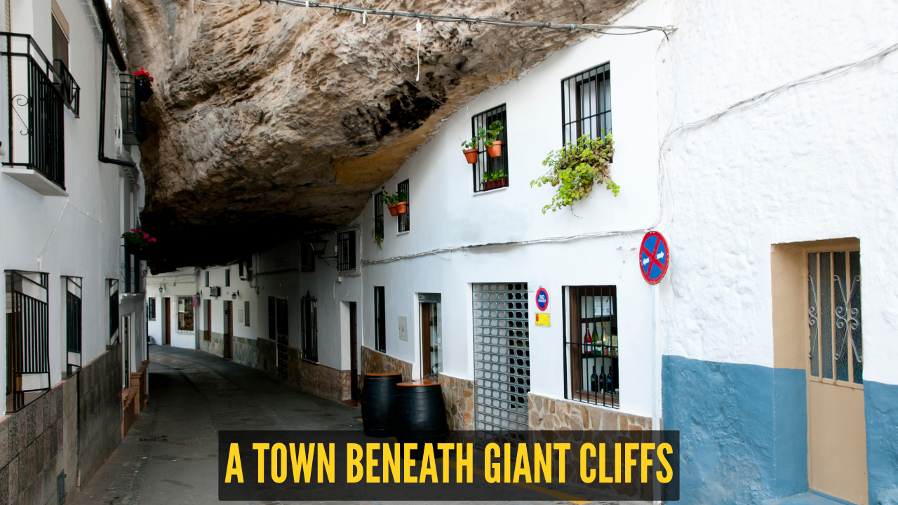 This town is built under massive cliffs and is becoming a must-visit ...