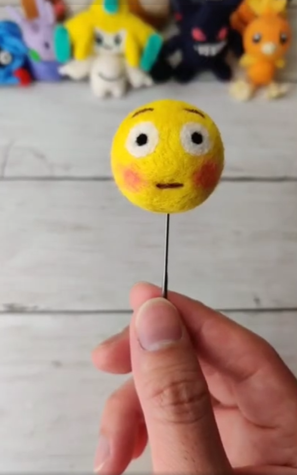 Creative emoji wool art with a satisfying twist